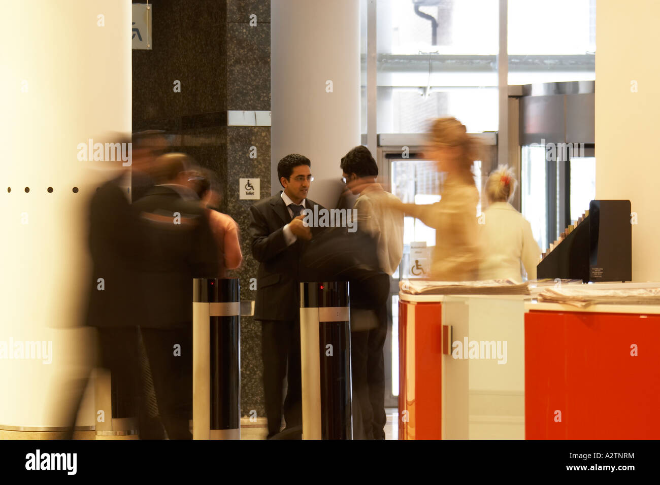 Security barriers in commercial office building reception lobby with ...