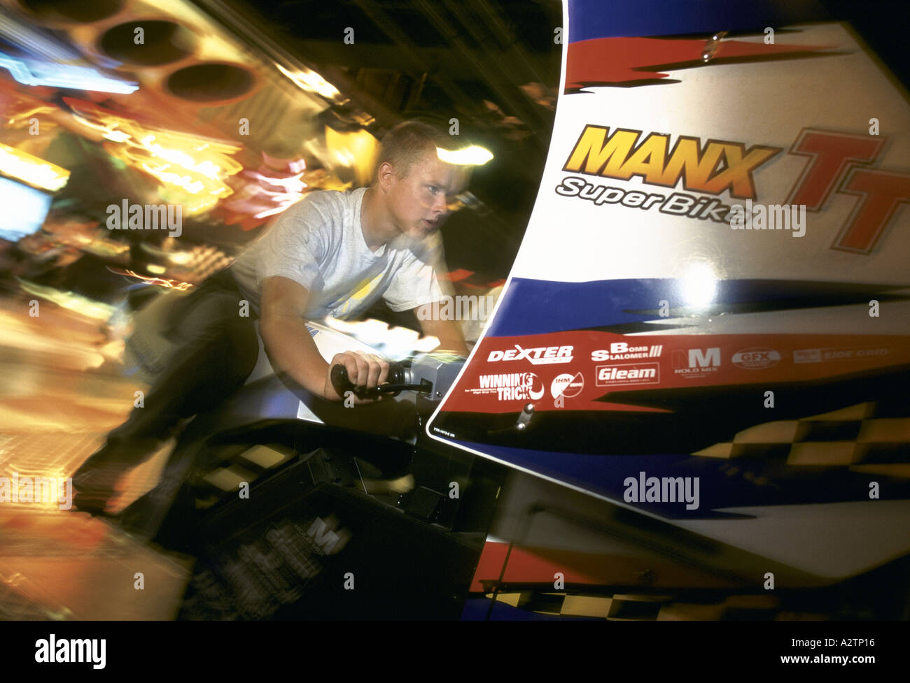 teenaged boy playing on manx superbike tt video game in sega world at ...