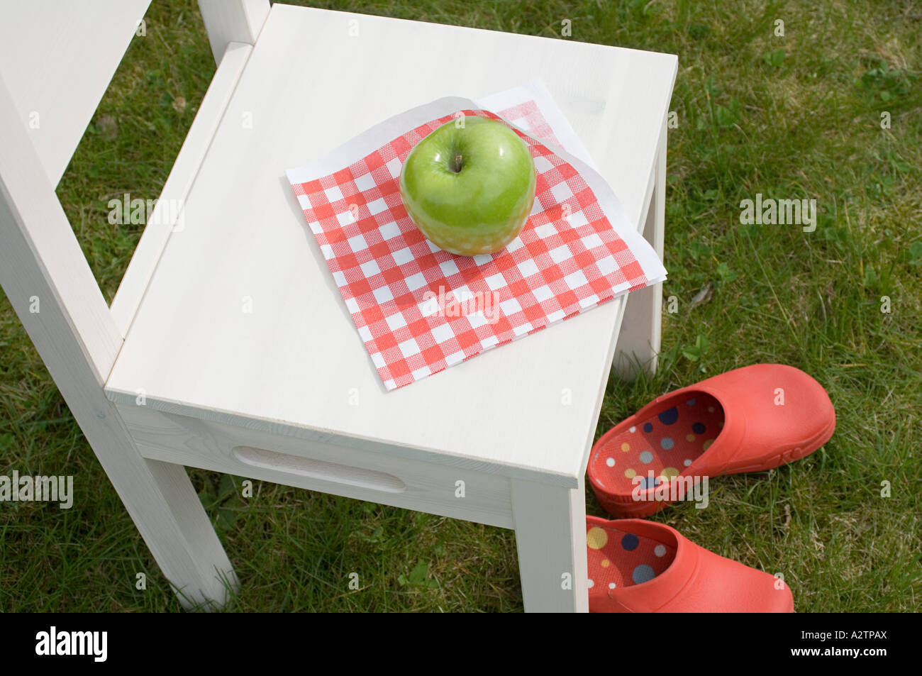 Apple on a chair Stock Photo - Alamy