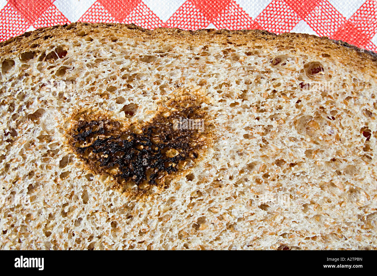 Heart shape burnt on toast Stock Photo - Alamy