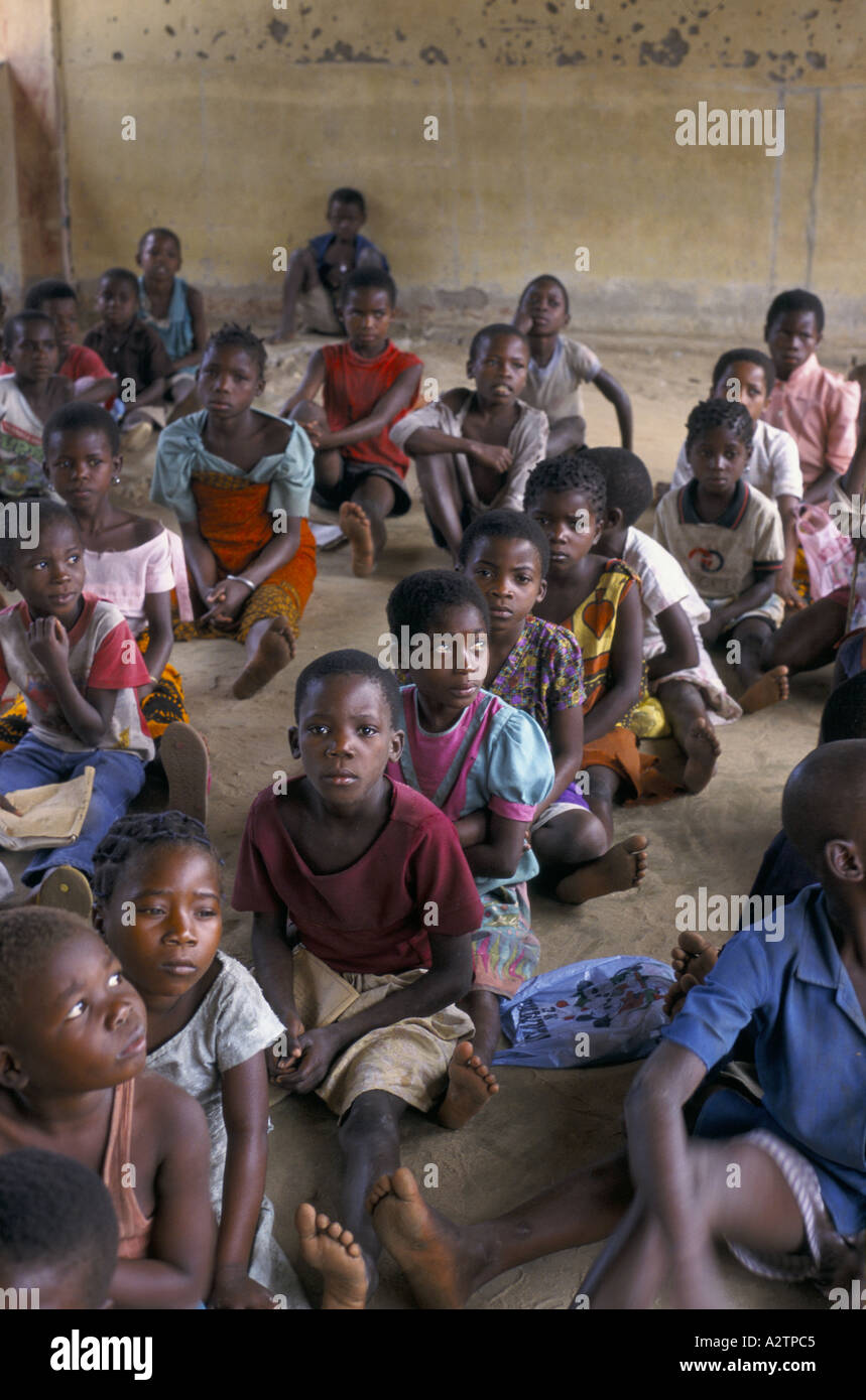 Mozambique. Cabo Delgado.Primary school .Children sitting on the mud ...