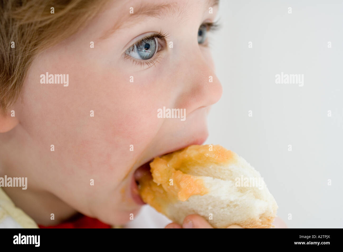 Child eating bread studio hi-res stock photography and images - Alamy