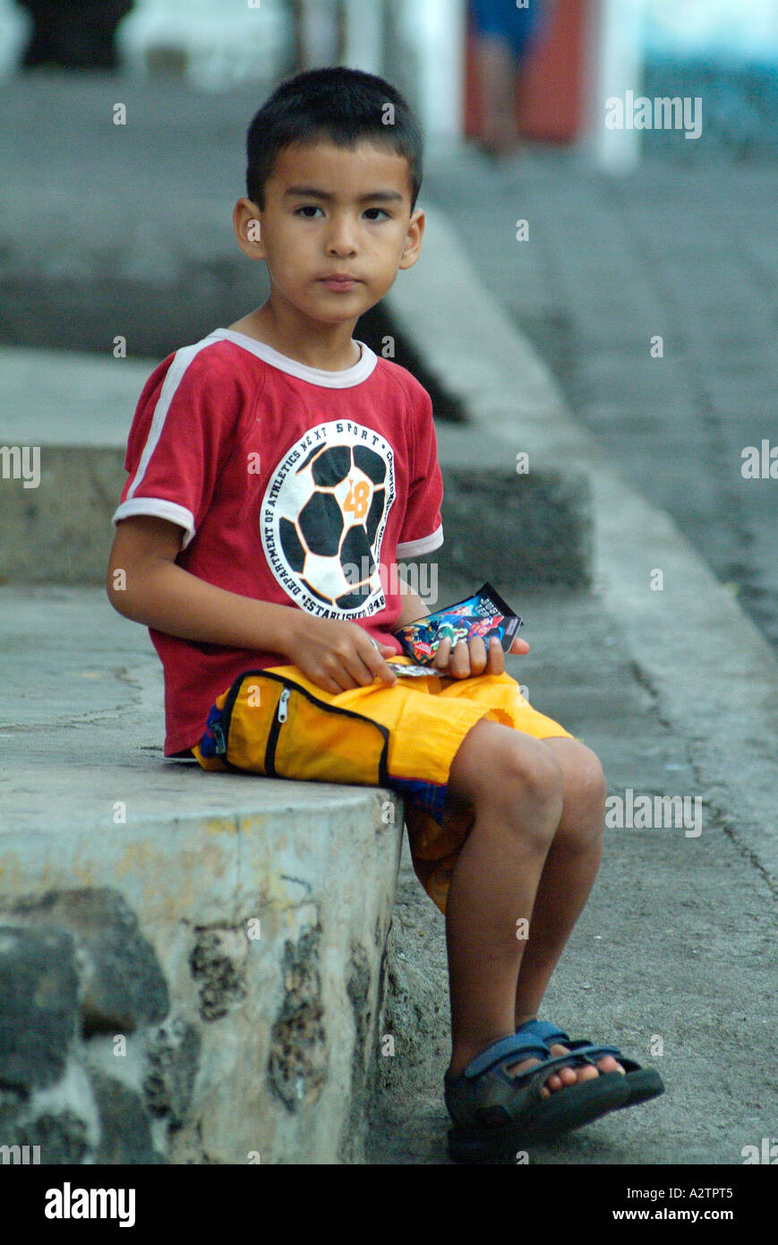 Young ecuadorian boy playaing cards in Santa Cruz, Ecuador Stock Photo ...