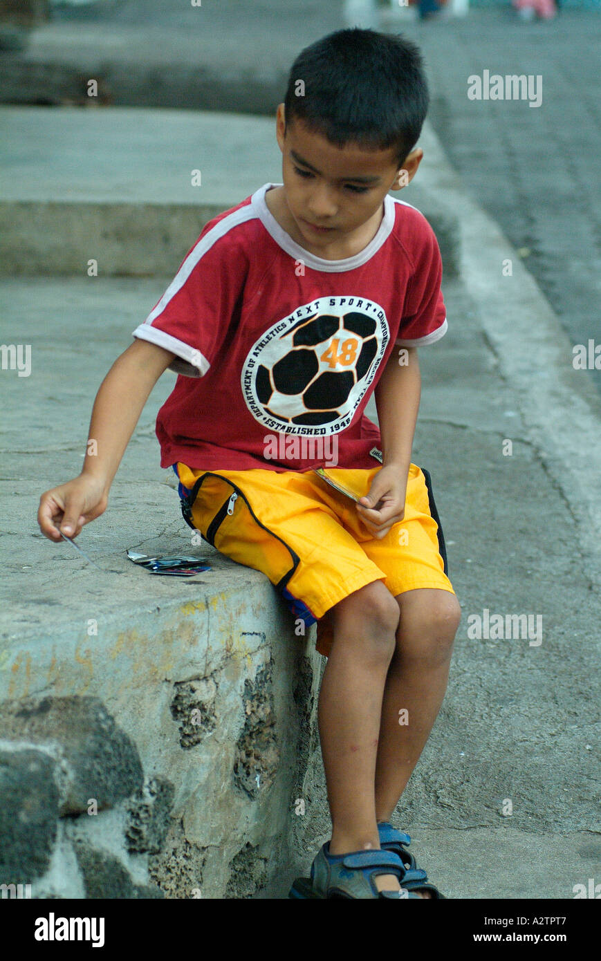 Young ecuadorian boy playaing cards in Santa Cruz, Ecuador Stock Photo ...