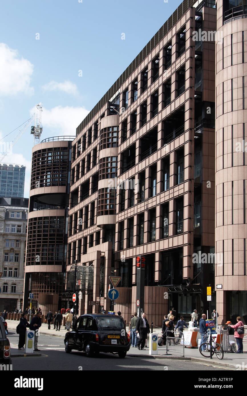 UBS office building with people and black taxi cab City of London EC2 ...