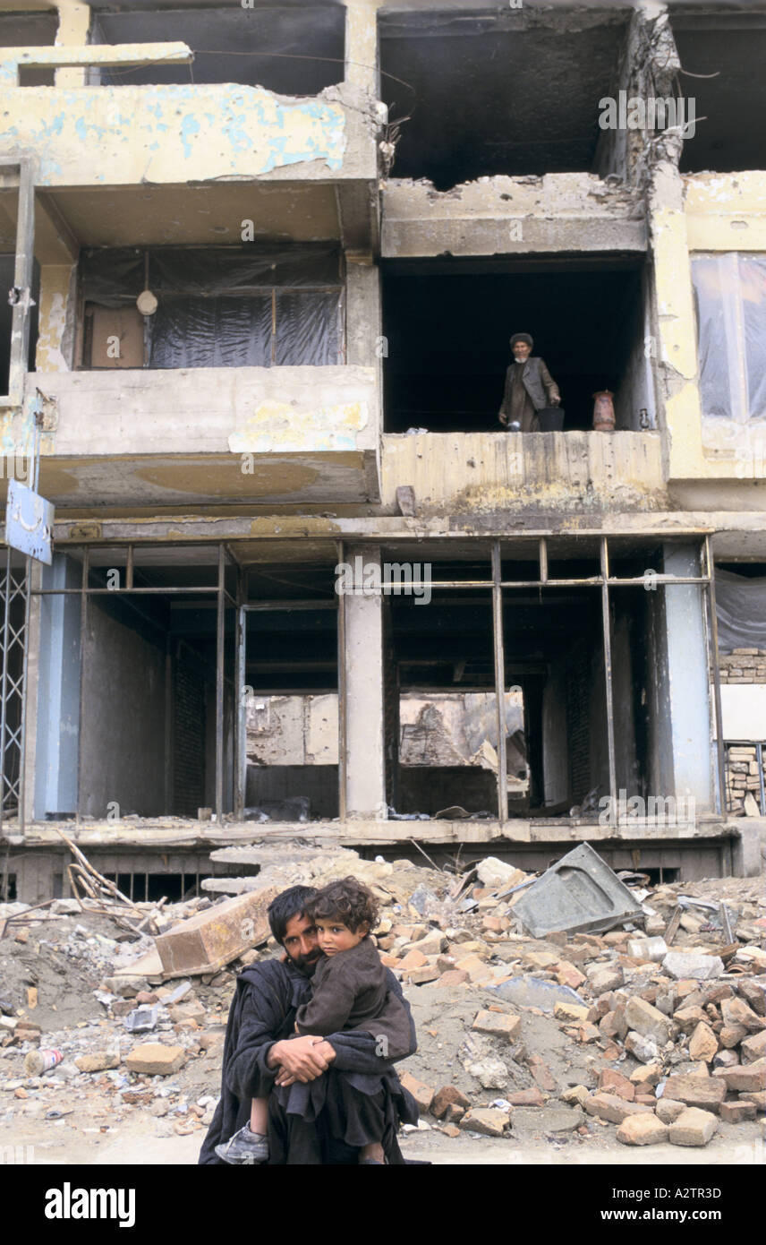 Father and son in front of damaged buildings Kabul Afghanistan 1996 ...
