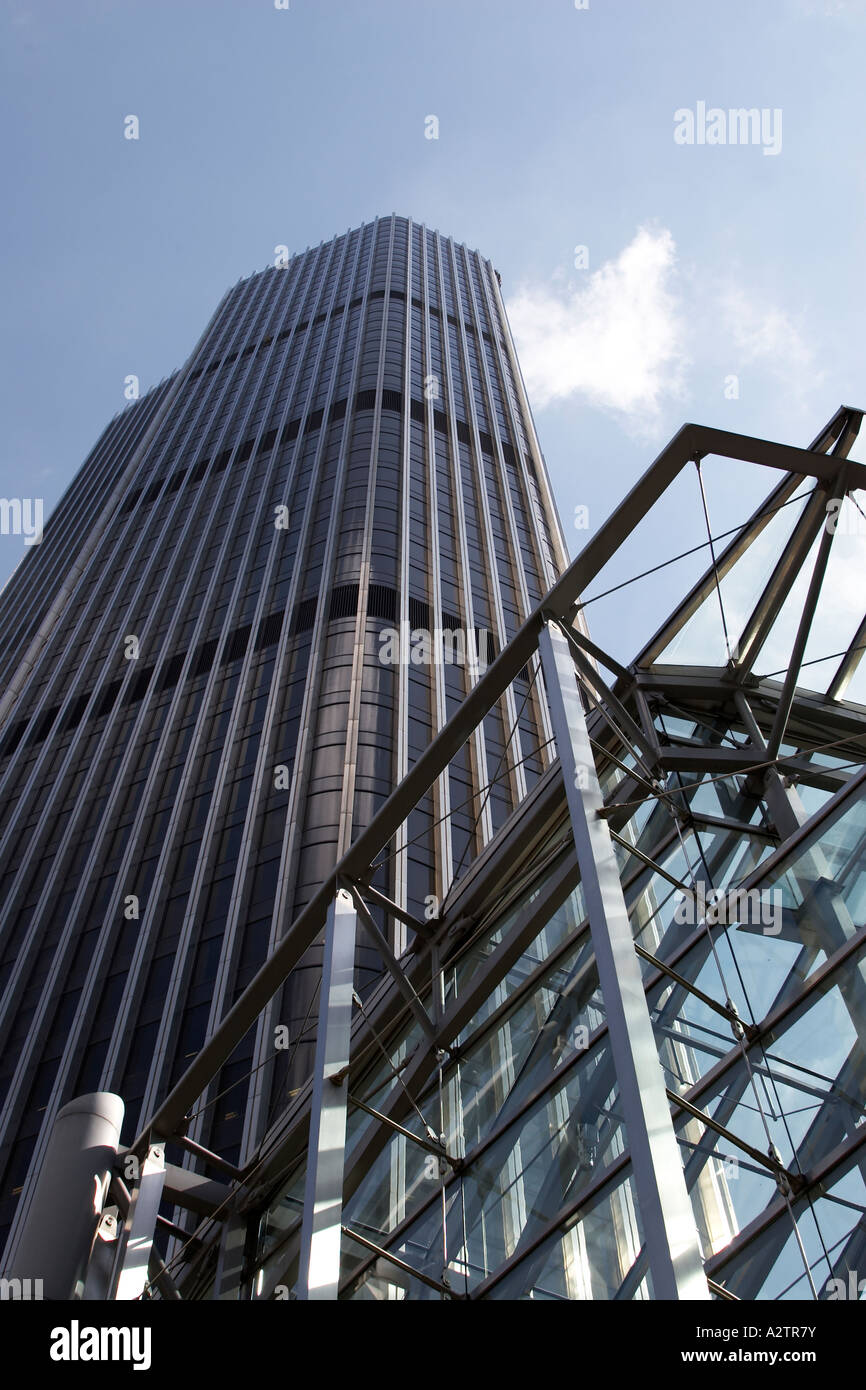 Tower 42 tall skyscraper commercial office building against blue sky ...