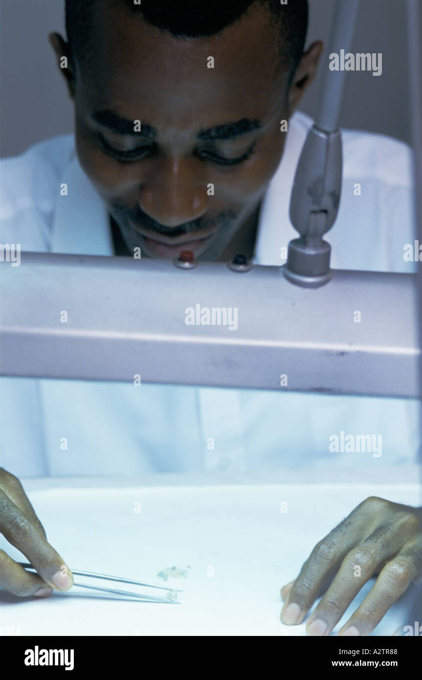 Diamond shop ,worker examining diamonds,Kisangani ,Congo1999 Stock ...