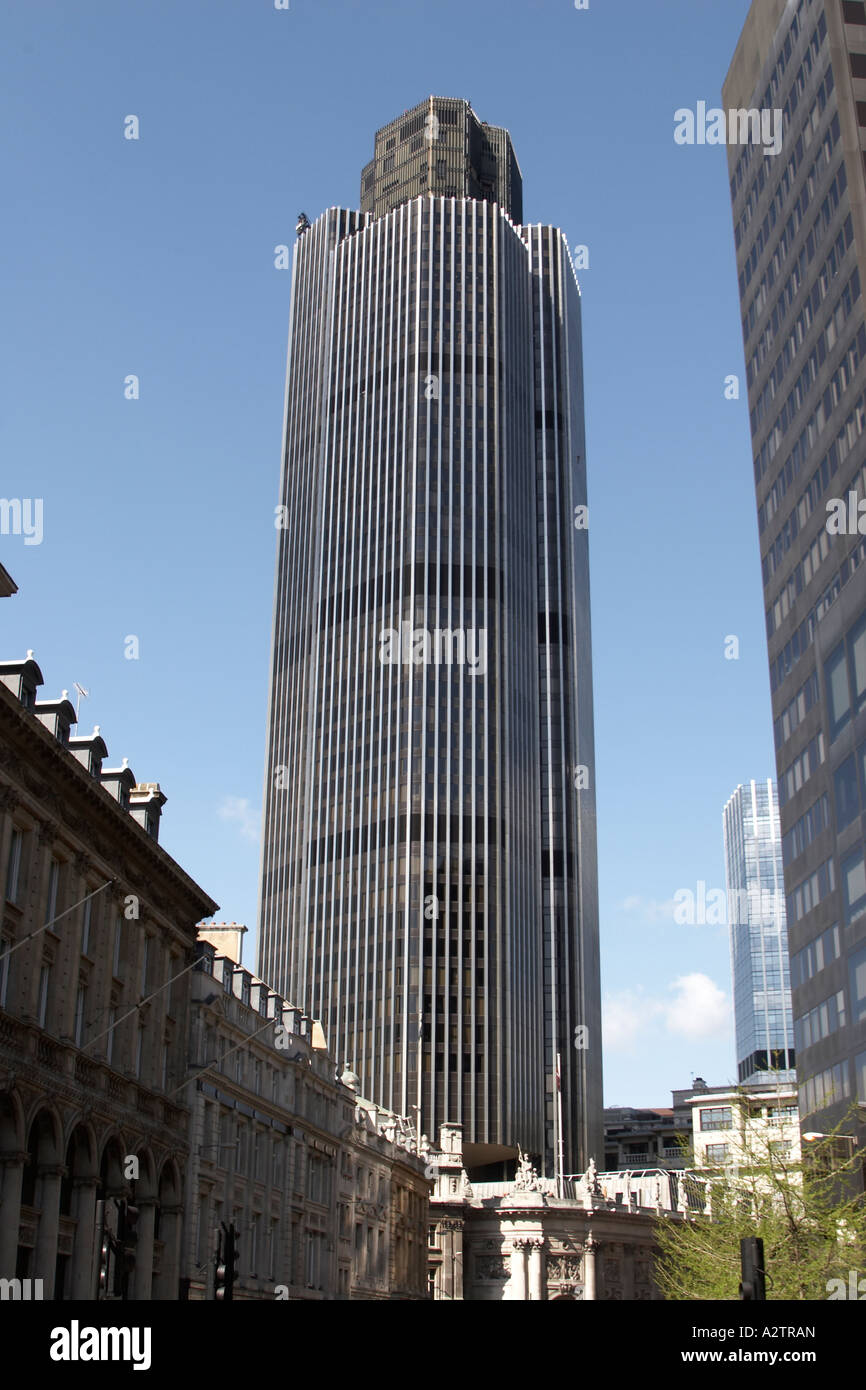 Tower 42 tall skyscraper commercial office building against blue sky ...
