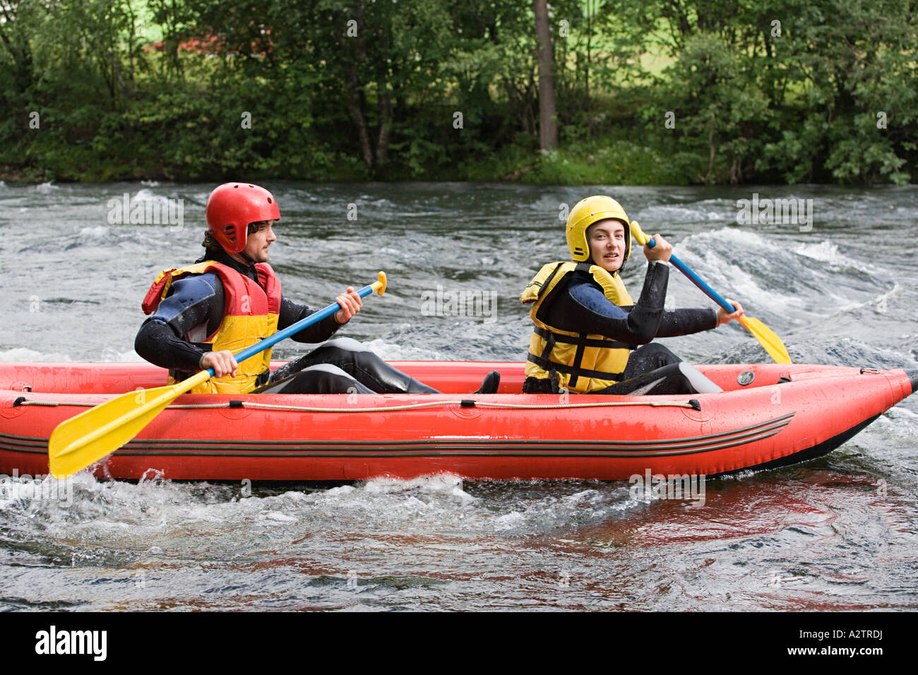 Two people white water rafting Stock Photo - Alamy
