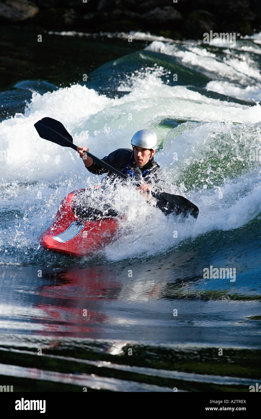 Man kayaking on river Stock Photo - Alamy