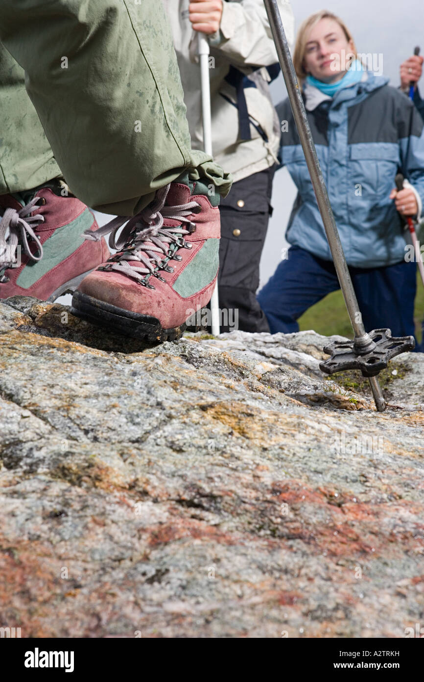 Hikers walking on rocks Stock Photo - Alamy