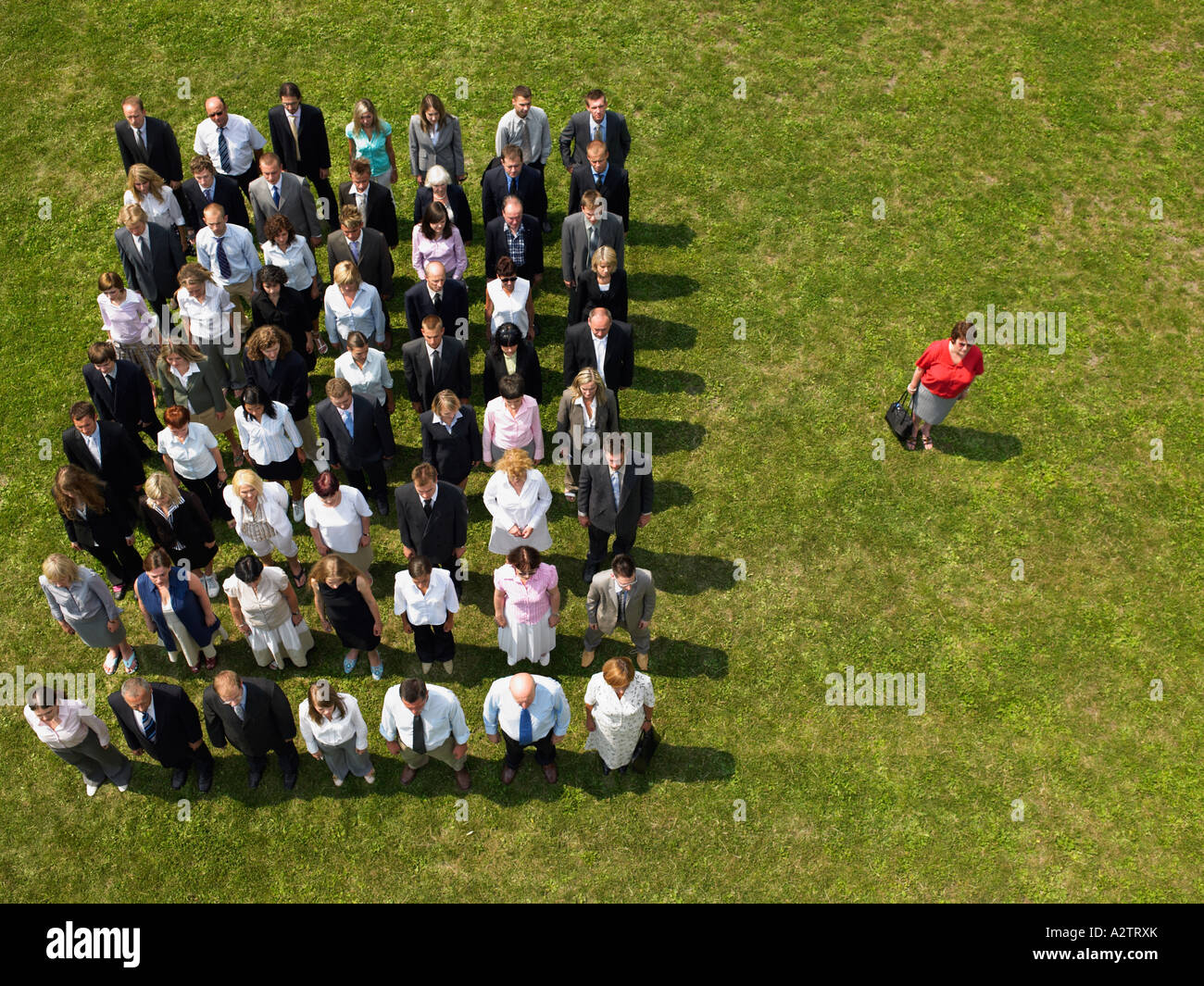 Woman separated from crowd Stock Photo - Alamy