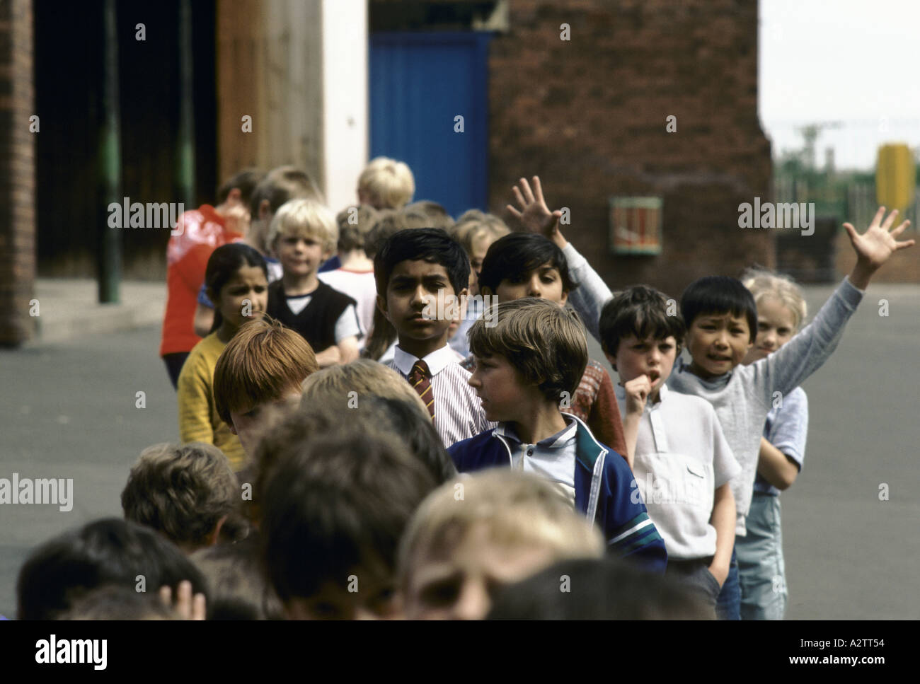 children lining up in playground Stock Photo - Alamy