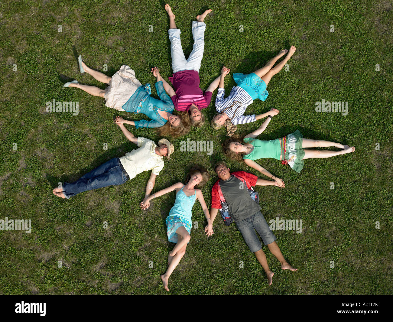 Friends sleeping holding hands Stock Photo - Alamy