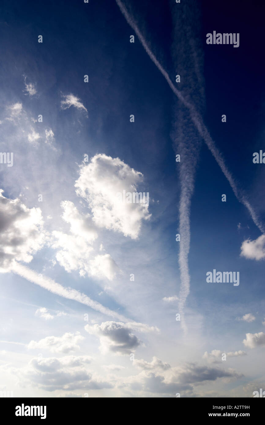 blue sky and clouds with aircraft vapour trails or contrails Stock ...