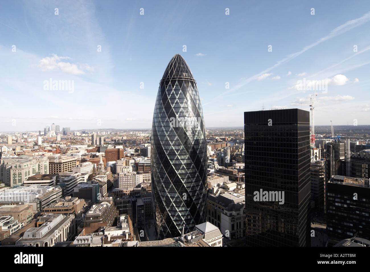High level semi aerial view south east to Canary Wharf of Gherkin and ...