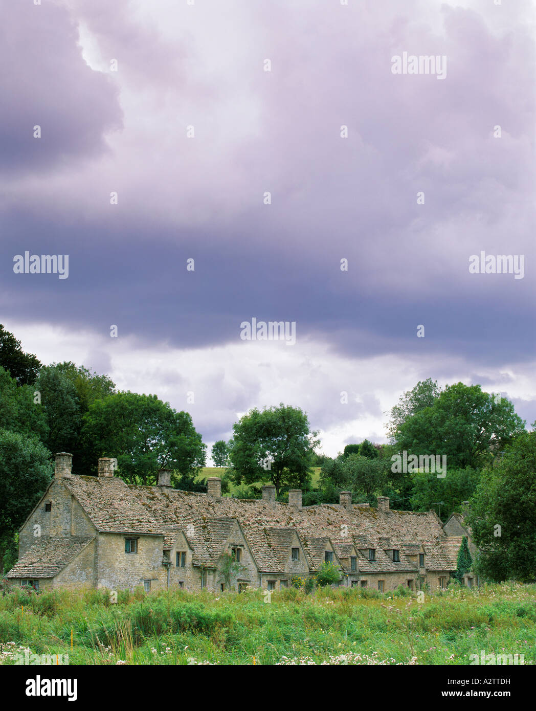 Medieval cottages at Arlington Row in the summer Bibury The Cotswolds ...