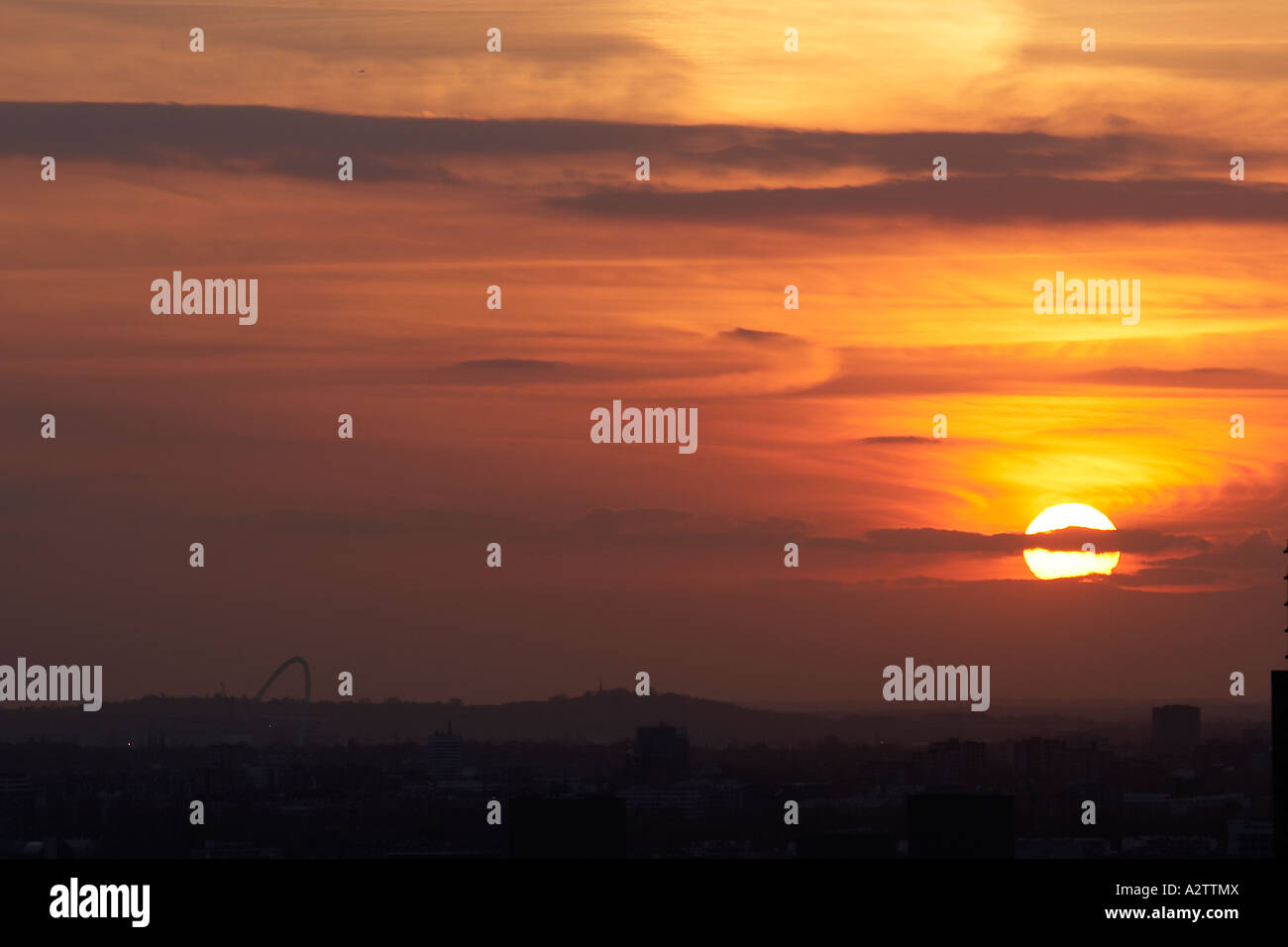 Sunset with sun setting in orange sky over Wembley Stadium from City of ...