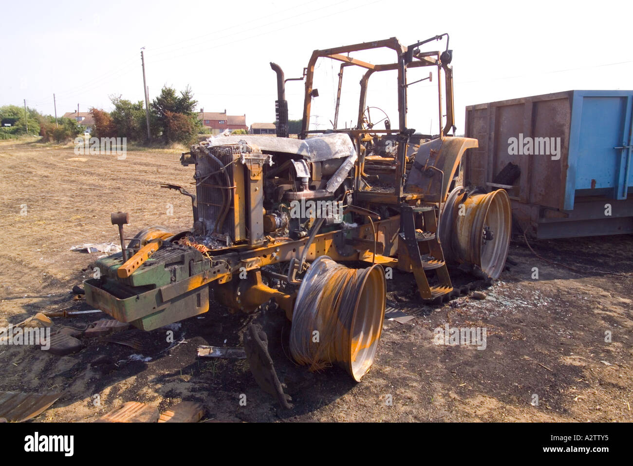 Burnt Tractor and trailer in Kent field Stock Photo - Alamy