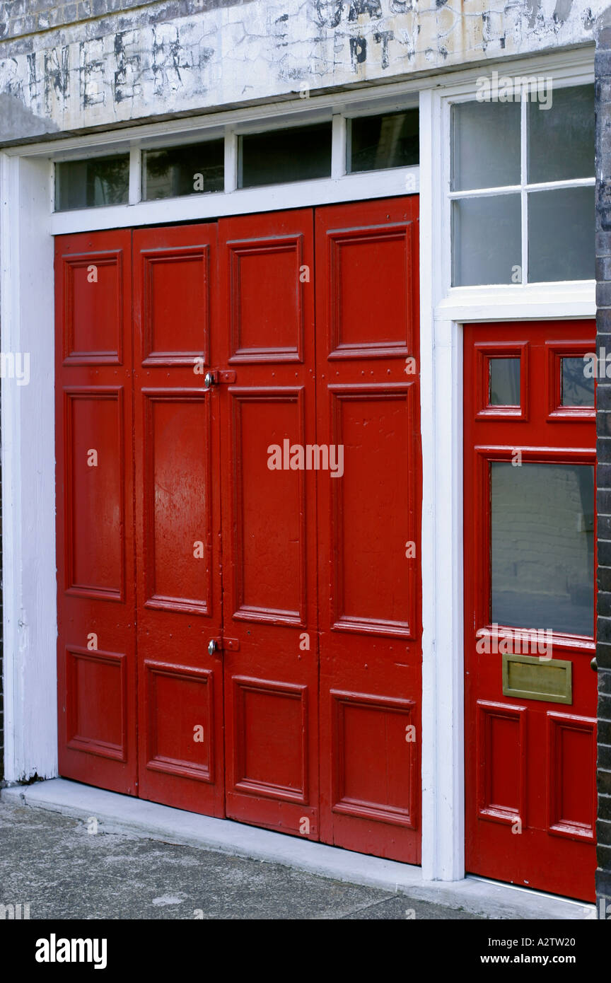 Red door in a building Stock Photo - Alamy
