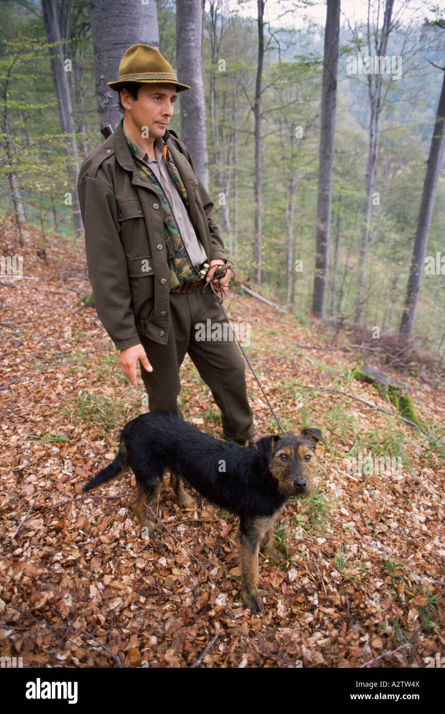 Forest ranger with hunting dog, Domnesti, Carpathian Mtns, Romania ...
