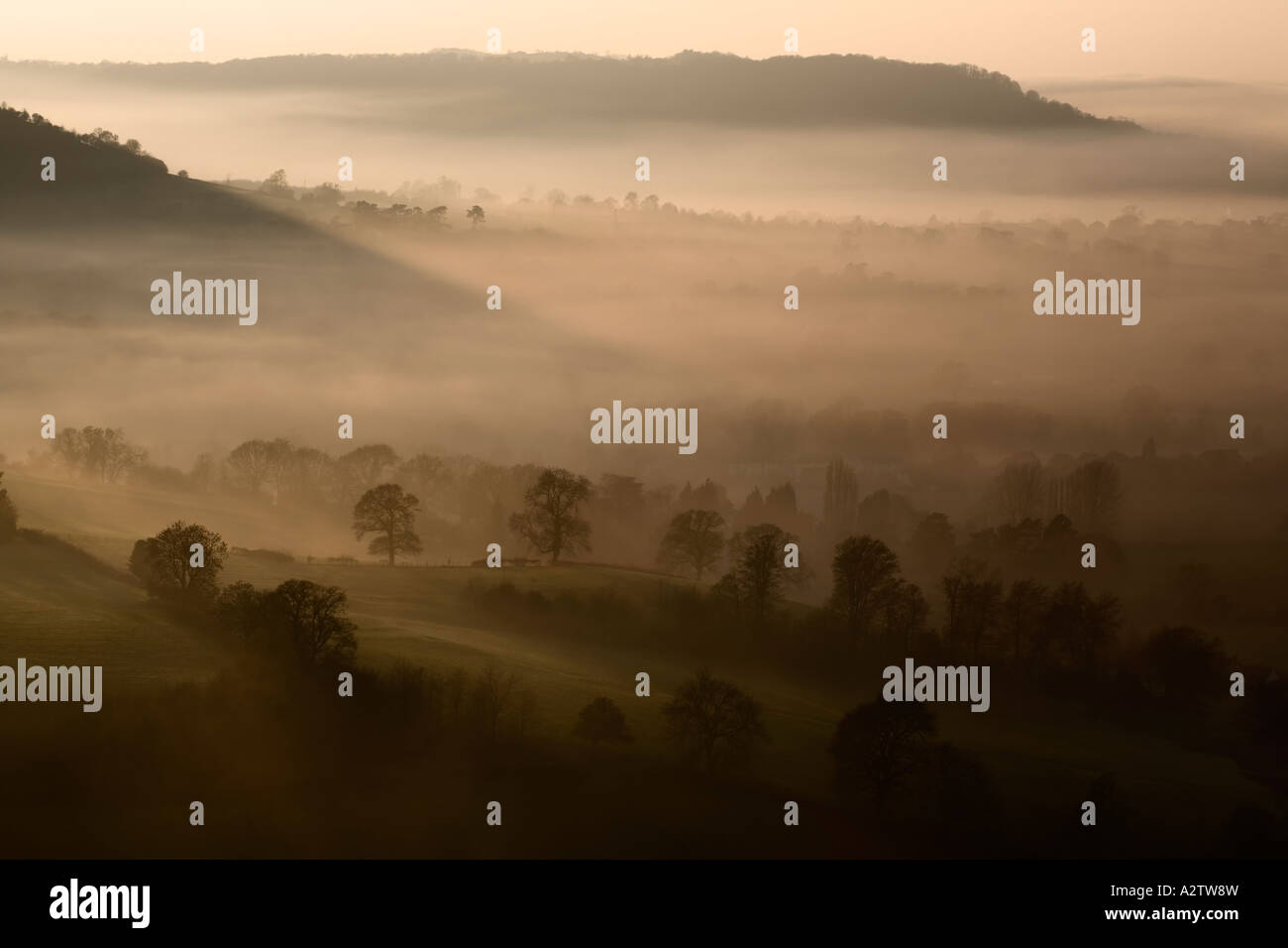 Countryside shrouded in mist from Coaley Peak on the Cotswold Way ...