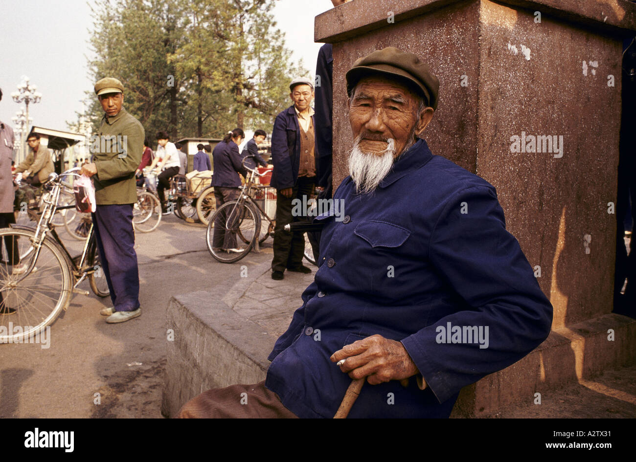 Old chinese man walking stick hi-res stock photography and images - Alamy