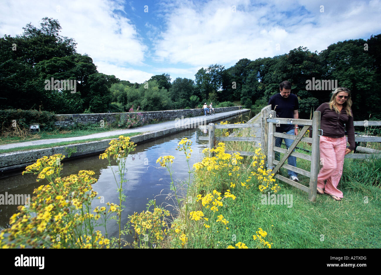 Walkers on the Taff Trail alongside the Monmouthshire & Brecon canal at ...