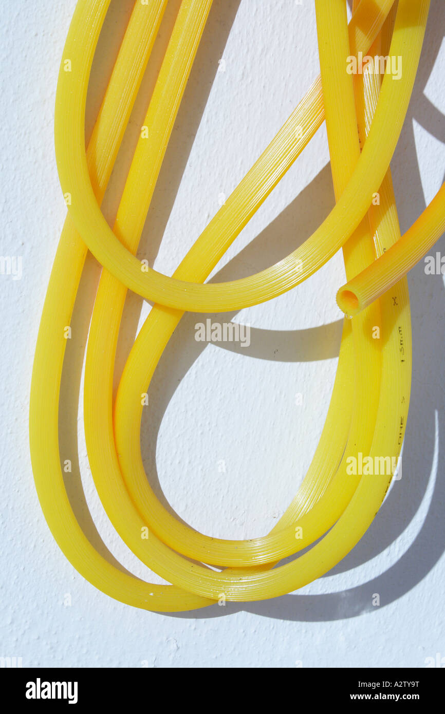 yellow pvc water hose Stock Photo - Alamy