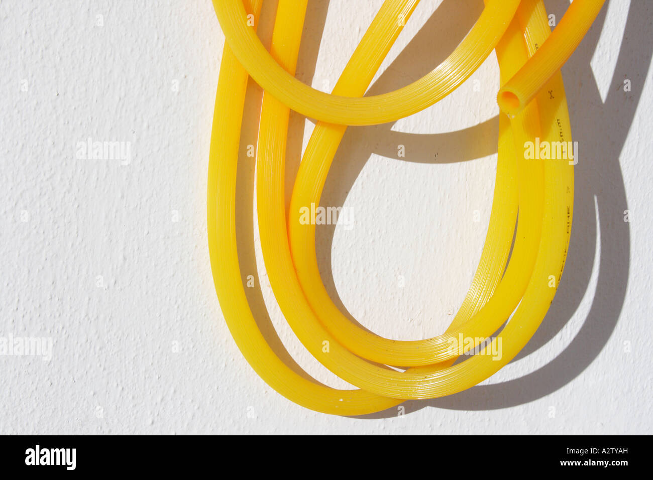 yellow pvc water hose Stock Photo - Alamy