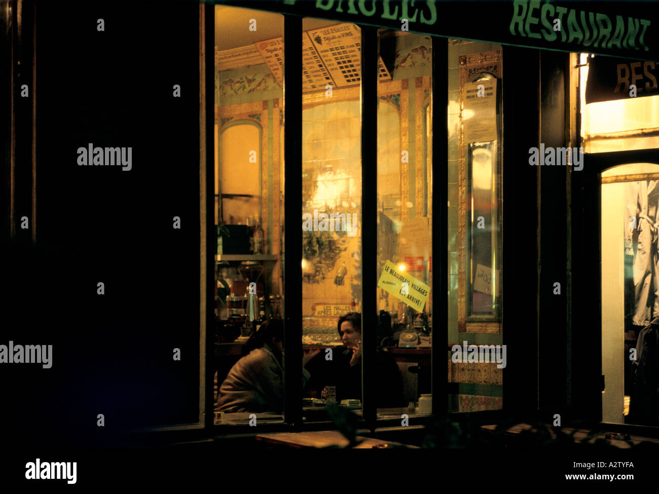 shop front of a cafe restaurant by night in paris Stock Photo - Alamy