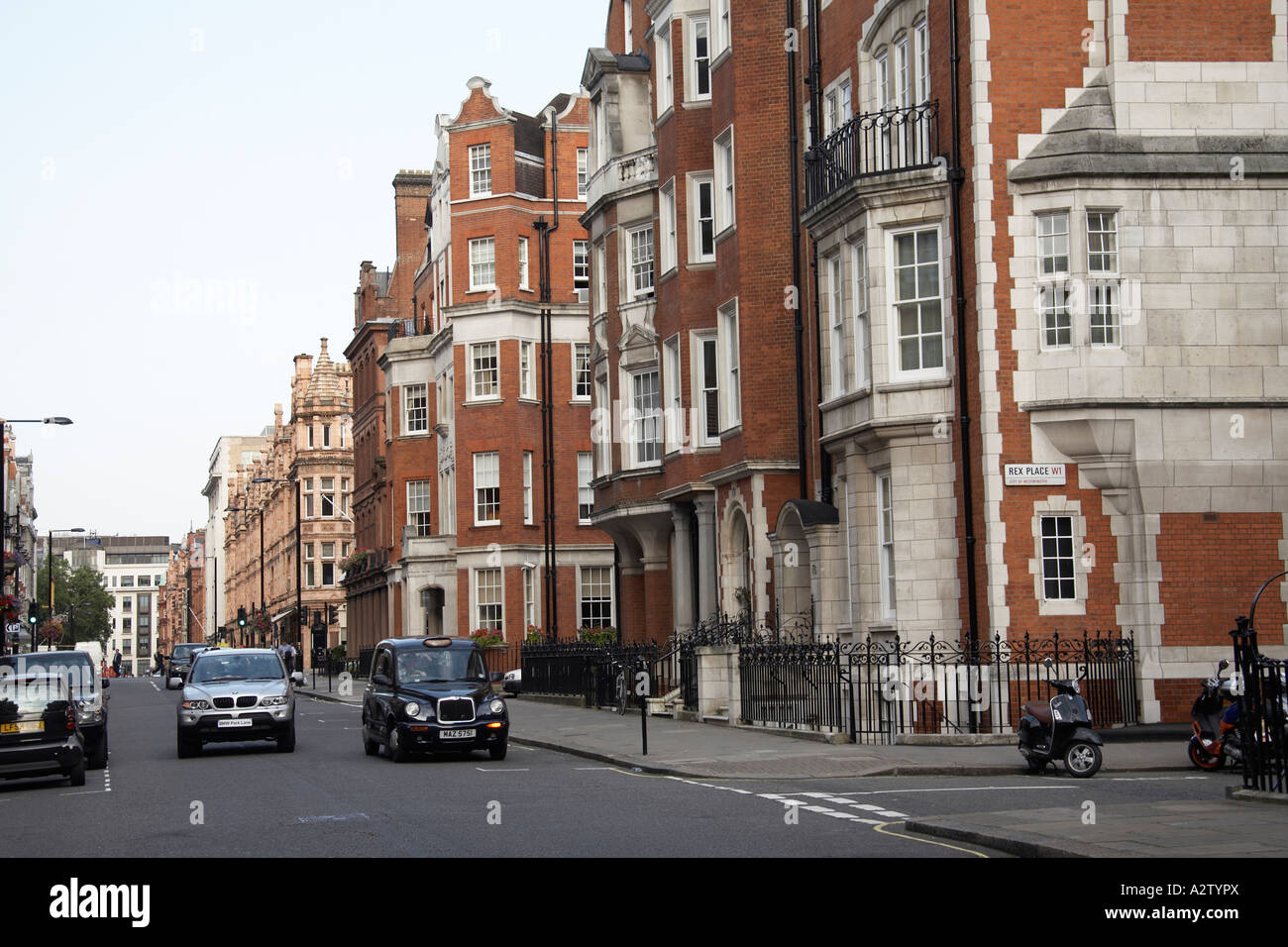 Buildings and traffic on Mount Street in Mayfair London W1 England ...