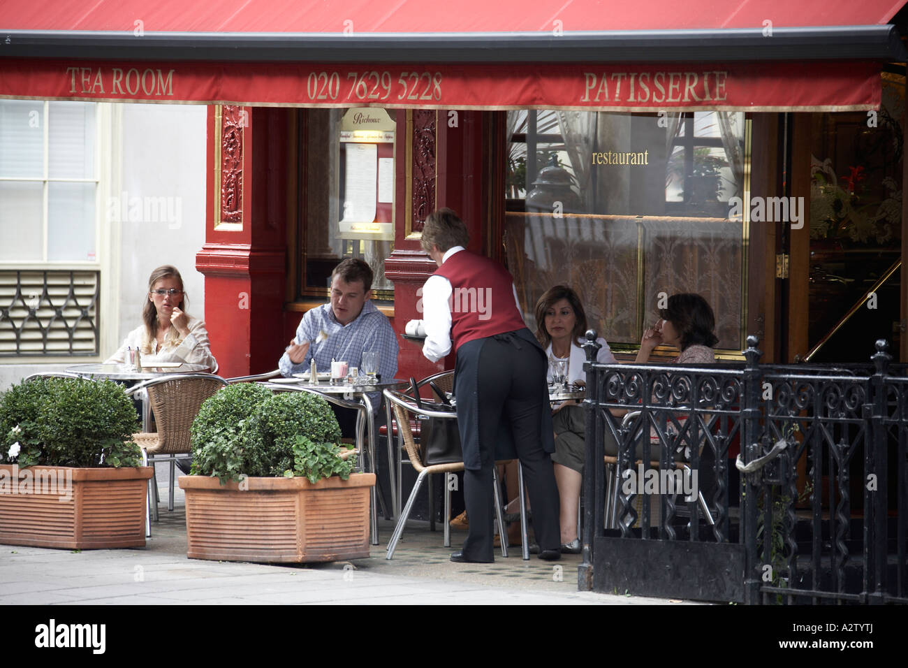 People drinking and talking outside The Audley pub in Mayfair London W1 ...