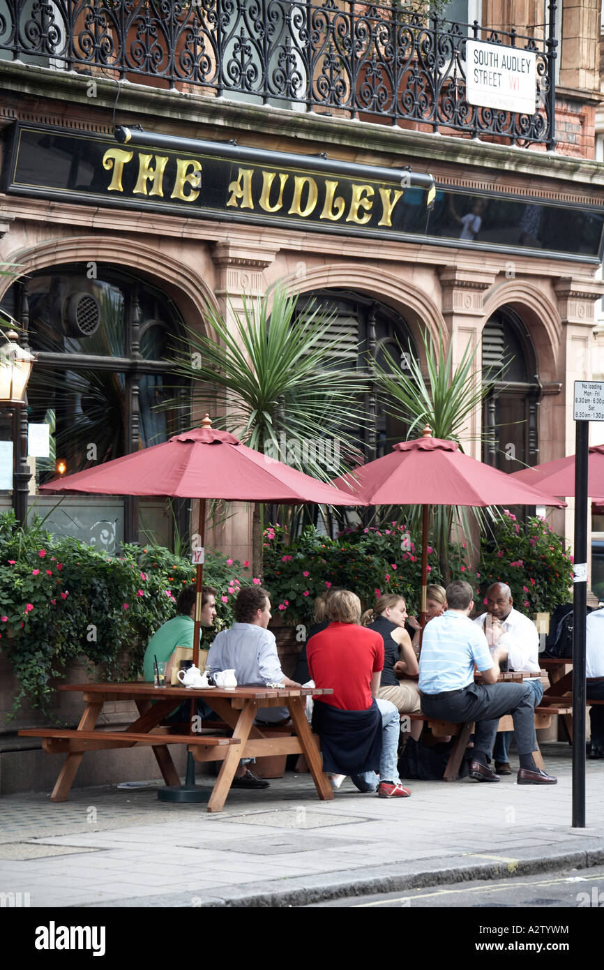 People drinking and talking outside The Audley pub in Mayfair London W1 ...