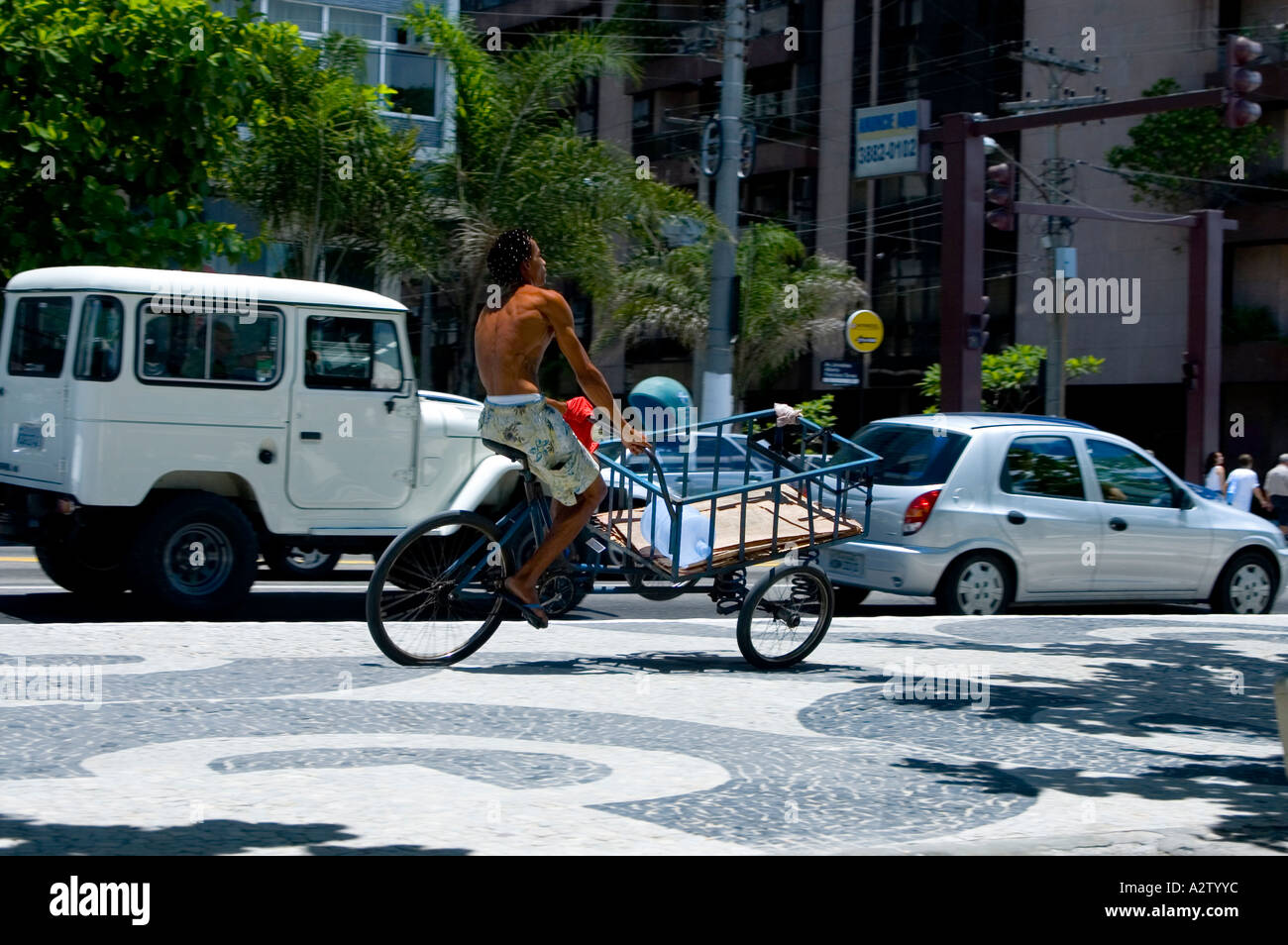Young biker. Young man riding a delivery bike in Rio de janeiro Brazil ...