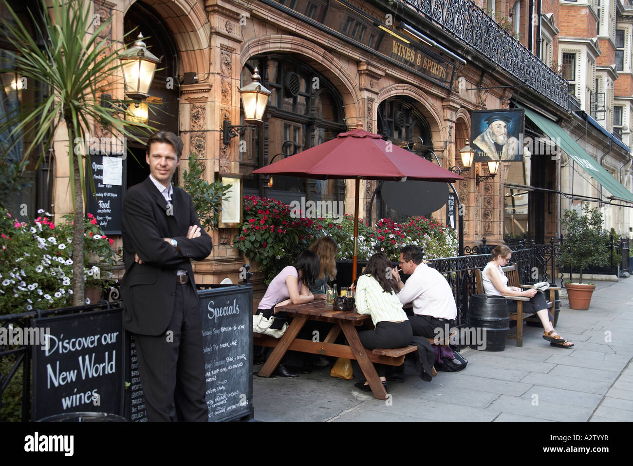 People drinking and talking outside The Audley pub in Mayfair London W1 ...