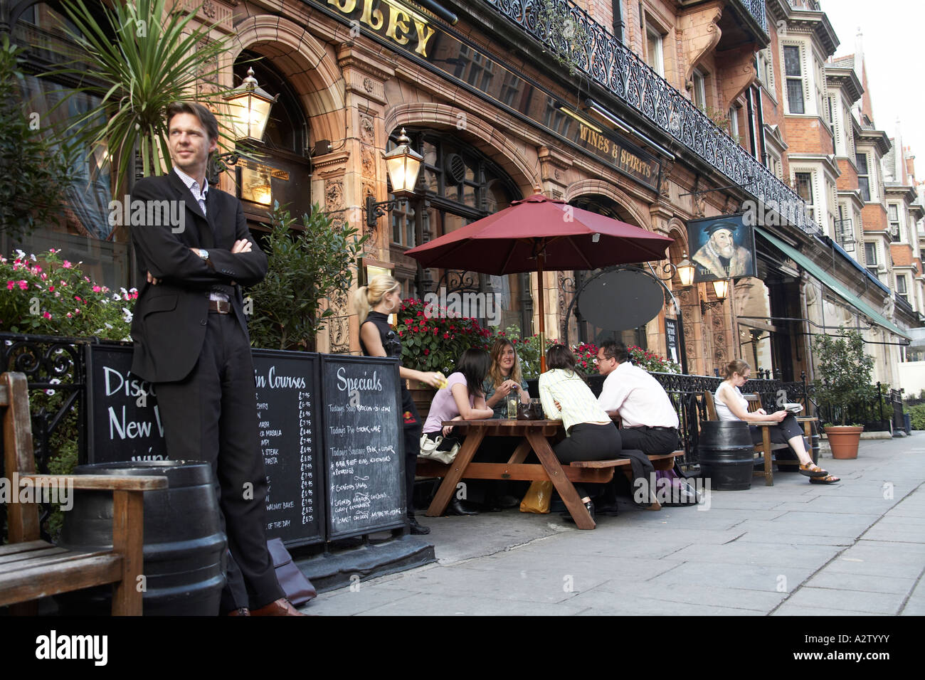 People drinking and talking outside The Audley pub in Mayfair London W1 ...