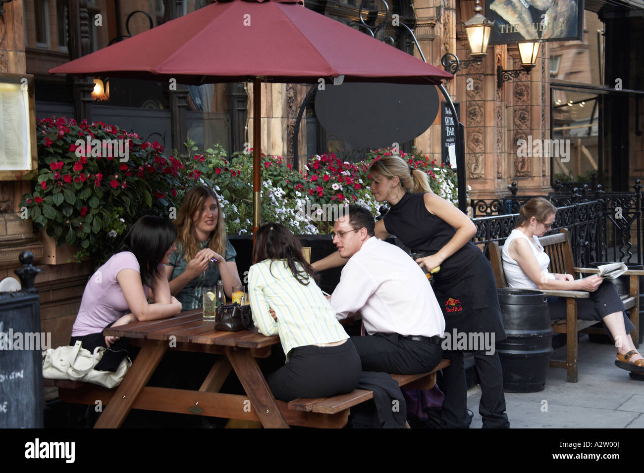 People drinking and talking outside The Audley pub in Mayfair London W1 ...