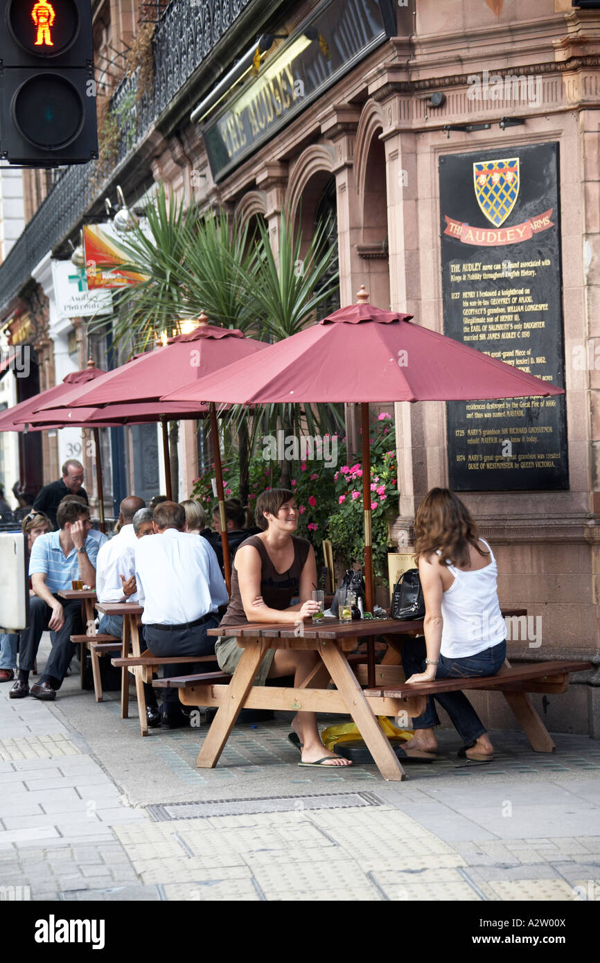 People drinking and talking outside The Audley pub in Mayfair London W1 ...