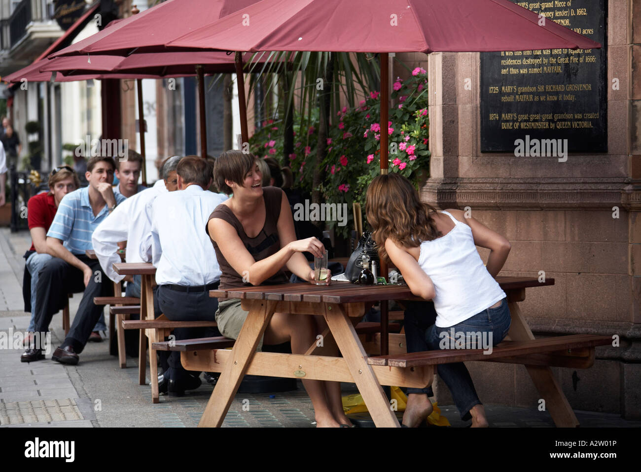 People drinking and talking outside The Audley pub in Mayfair London W1 ...