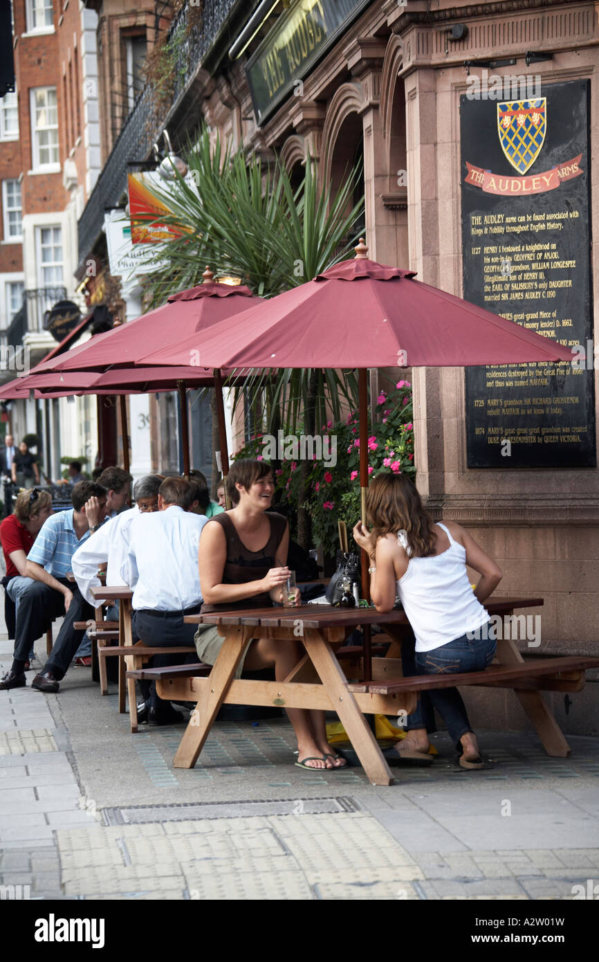 People drinking and talking outside The Audley pub in Mayfair London W1 ...