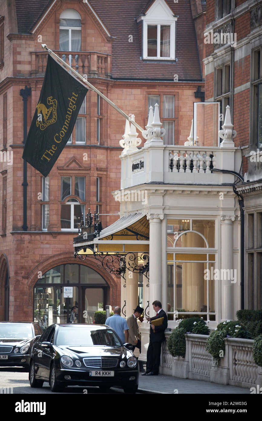 People with Doorman and Mercedes limousine outside the Connaught Hotel ...