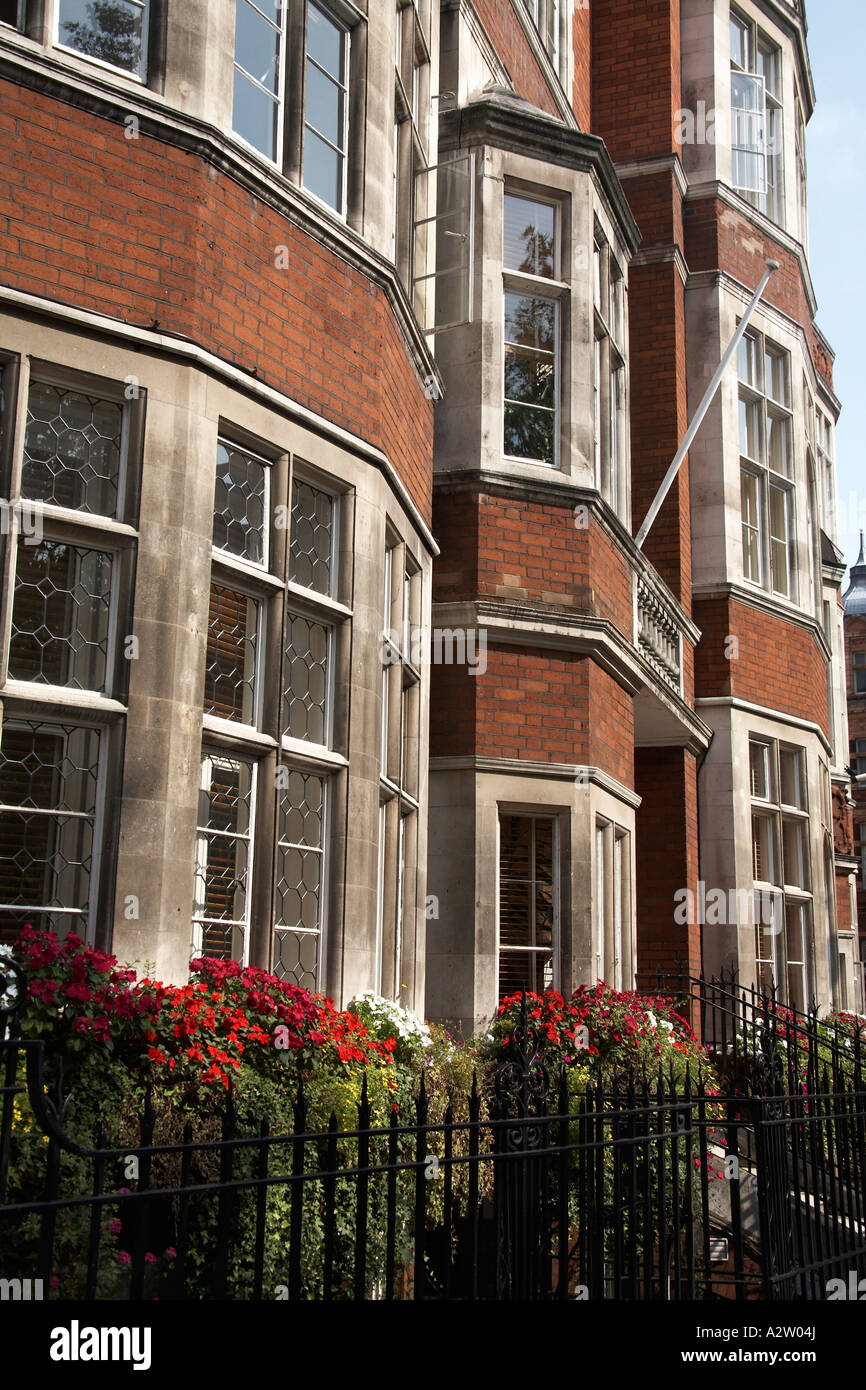 Mount Street red brick buildings with flowers in Mayfair London W1 ...