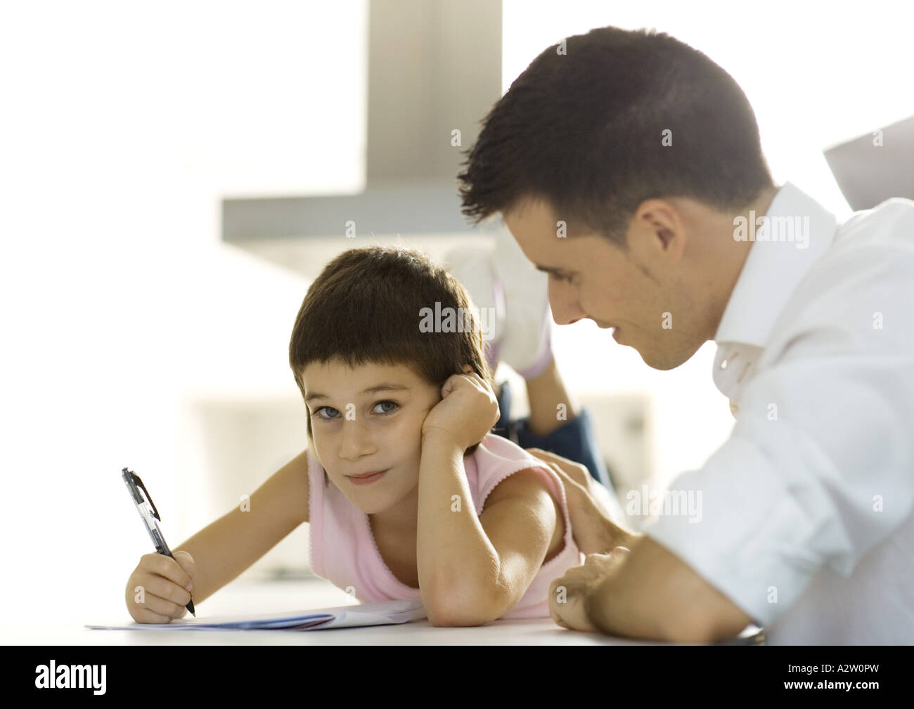 Father helping child with homework Stock Photo - Alamy
