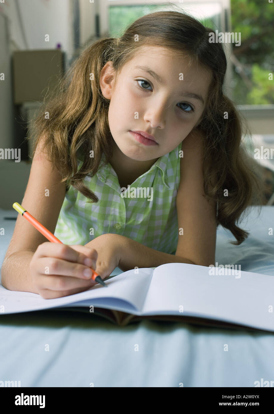 Girl doing homework Stock Photo - Alamy