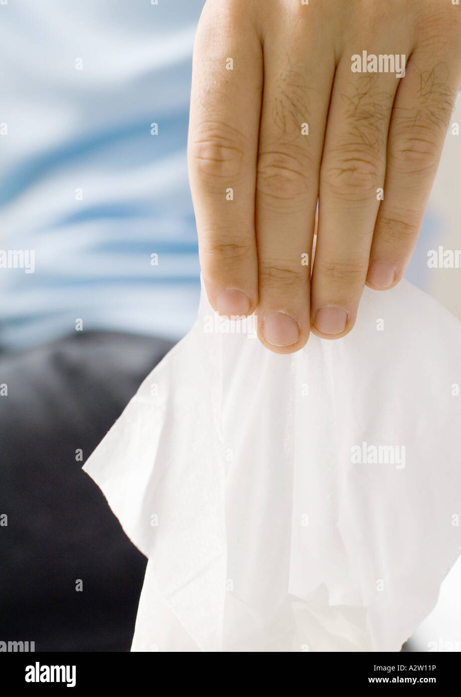Hand pulling facial tissue Stock Photo - Alamy