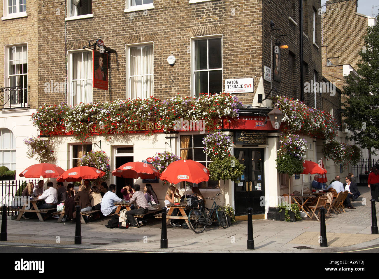 Duke of Wellington pub with people drinking outside in late summer in ...