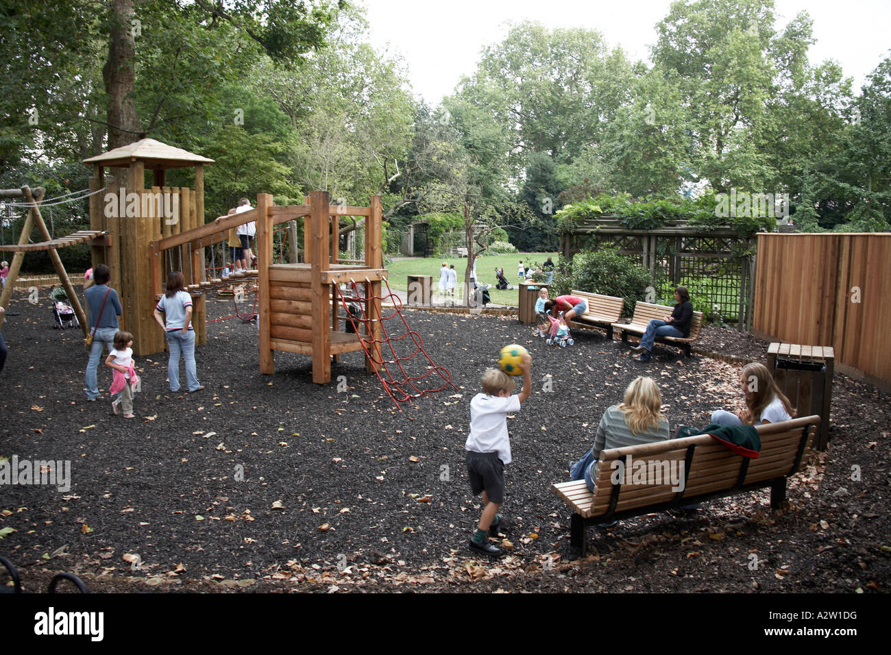 Children playing in Belgrave Square adventure playground in Belgravia ...