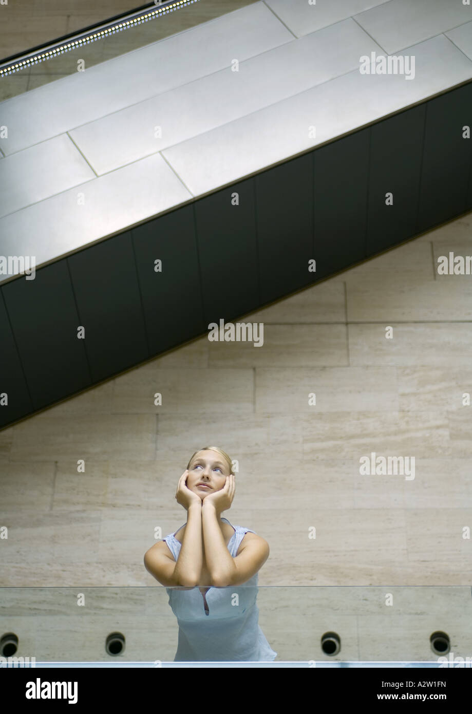 Holding escalator rail hi-res stock photography and images - Alamy